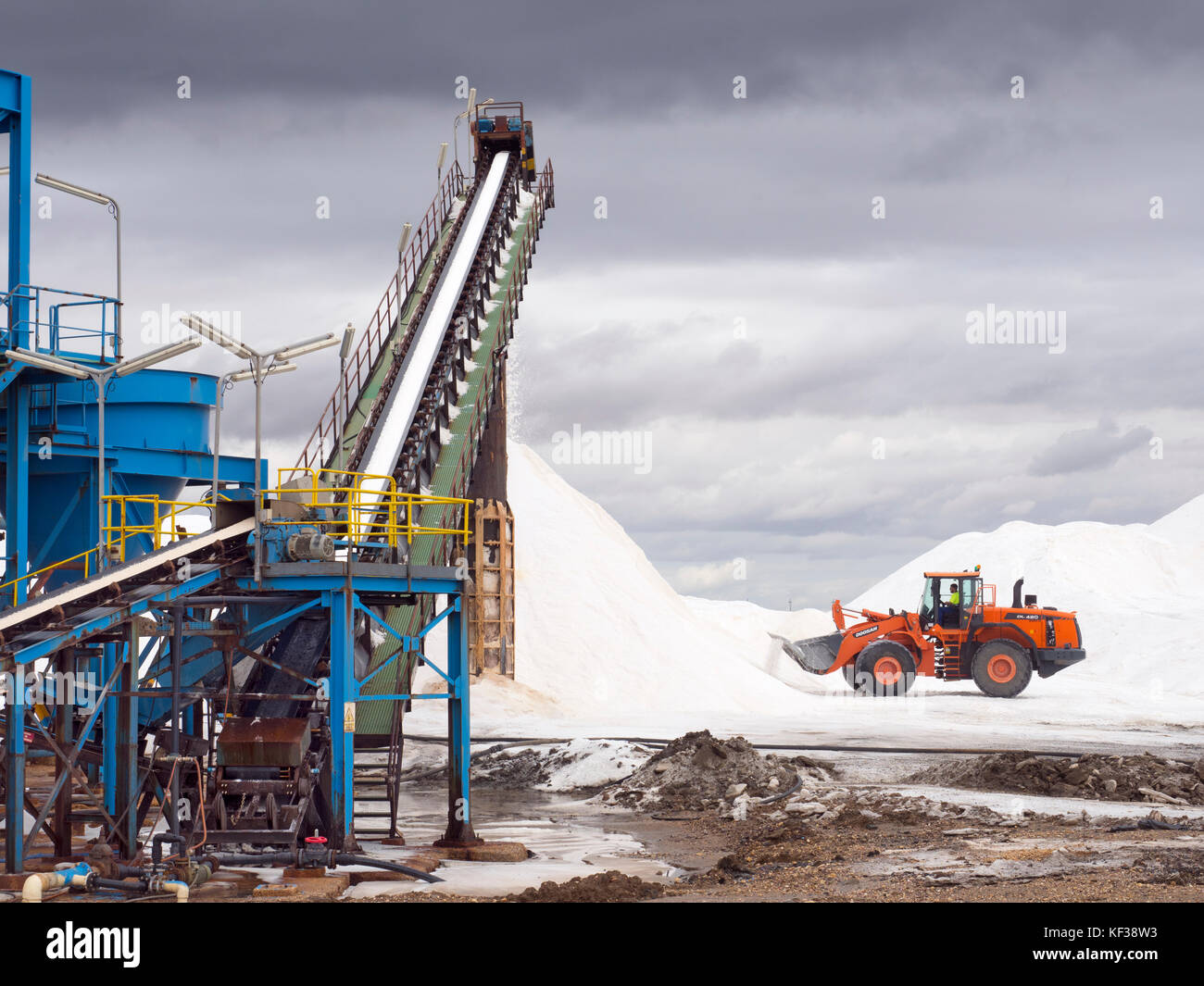 Salt being processed and broken down by machinery in Spain Stock Photo ...