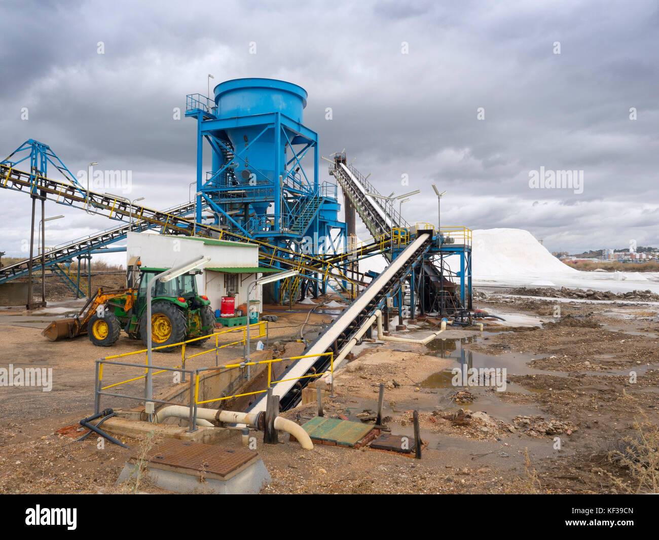 Salt being processed and broken down by machinery in Spain Stock Photo ...