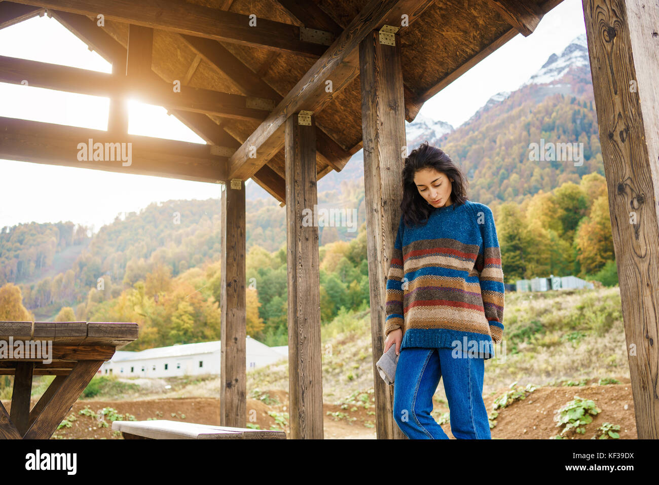 Girl travel in mountains alone. Spring weather, calm scene. Backpacker walking outdoors, view ...