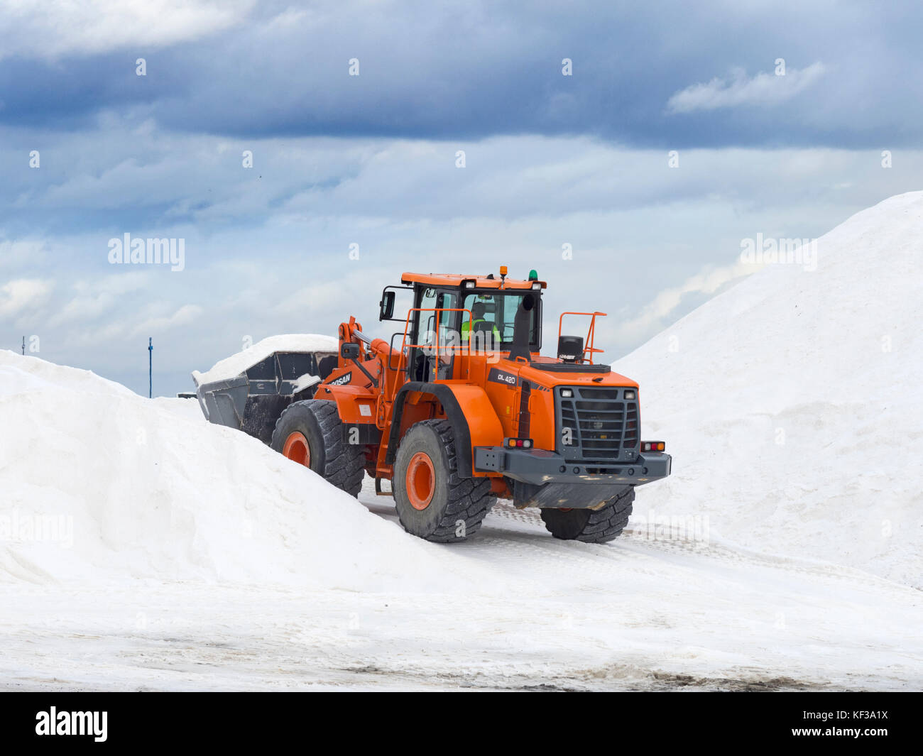 Salt being processed and broken down by machinery in Spain Stock Photo ...