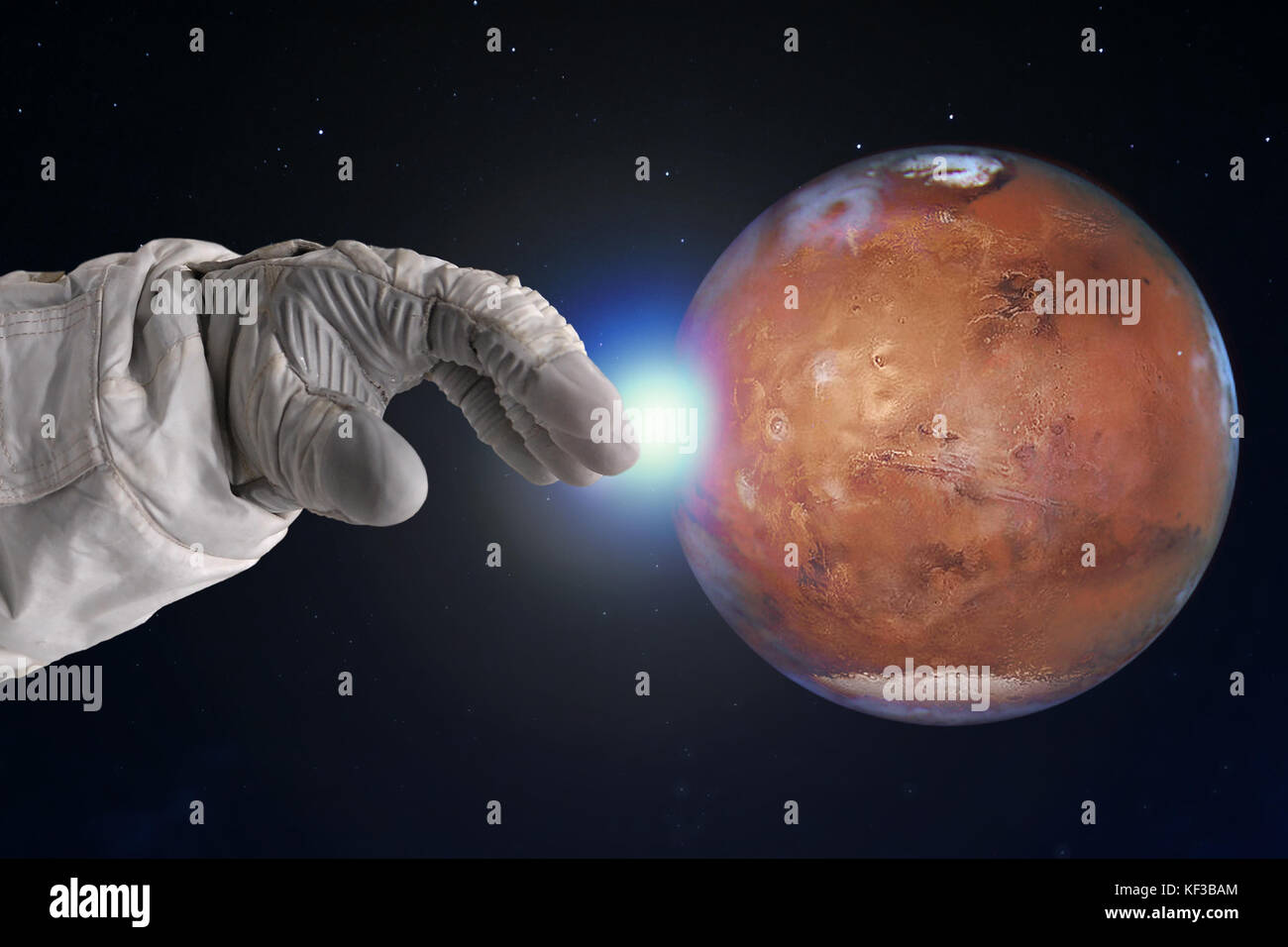 The development of Mars, concept. Hand of astronaut reaches out to Mars ...