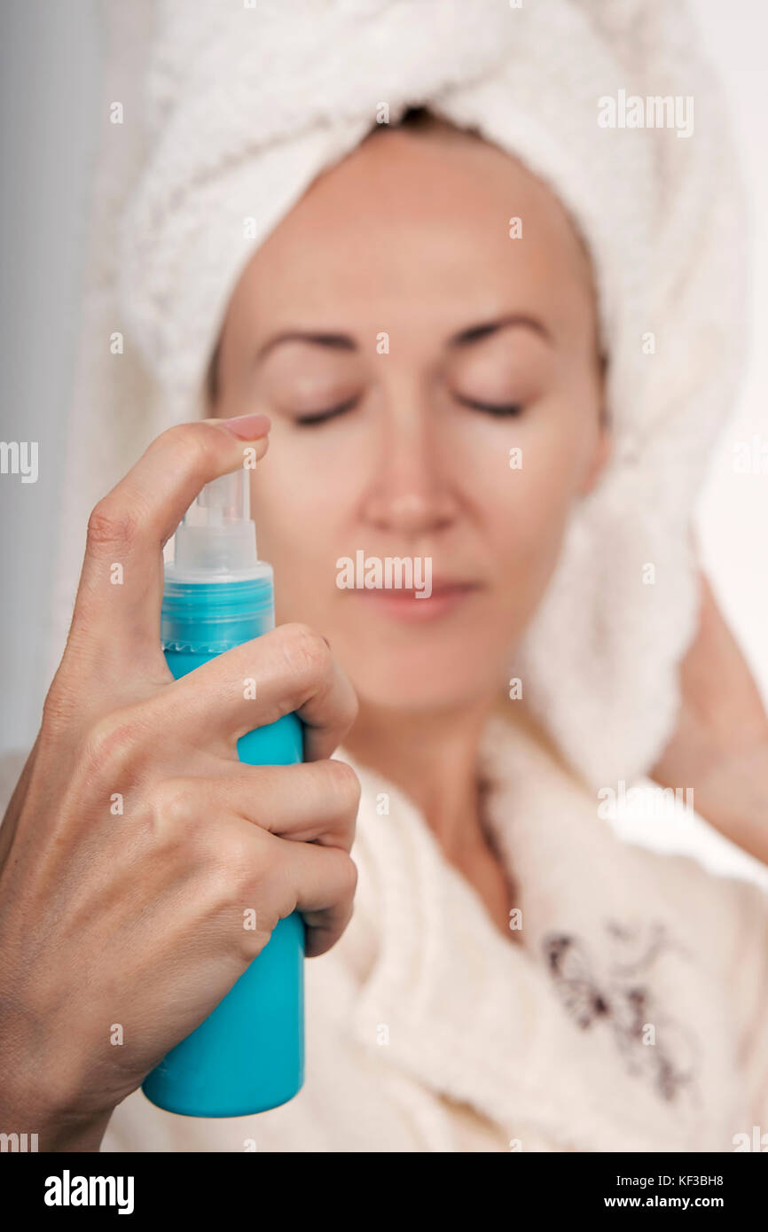 girl in a Bathrobe with spray Stock Photo - Alamy