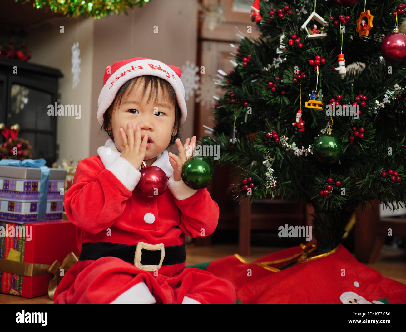 Happy santa baby girl Stock Photo - Alamy