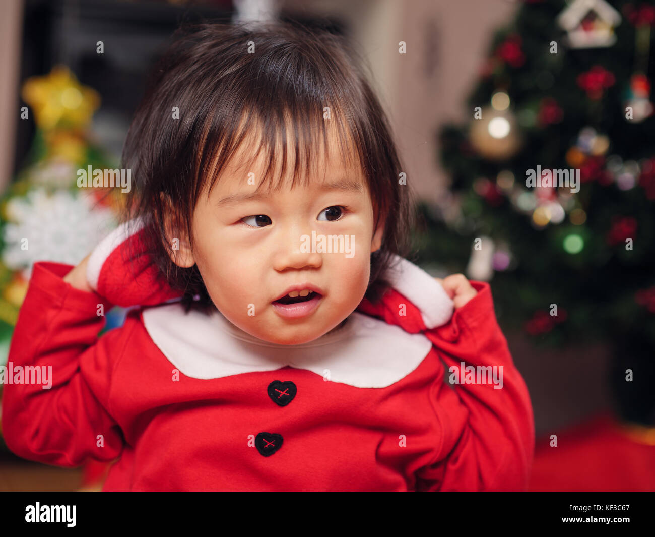 Happy santa baby girl Stock Photo - Alamy