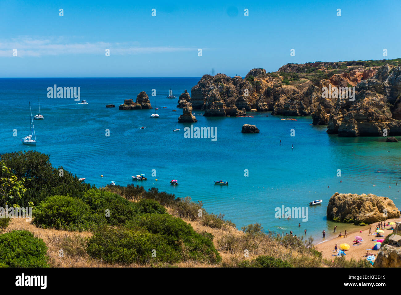 Praia, beautiful sea view with sandy beach among rocks and cliffs in ...