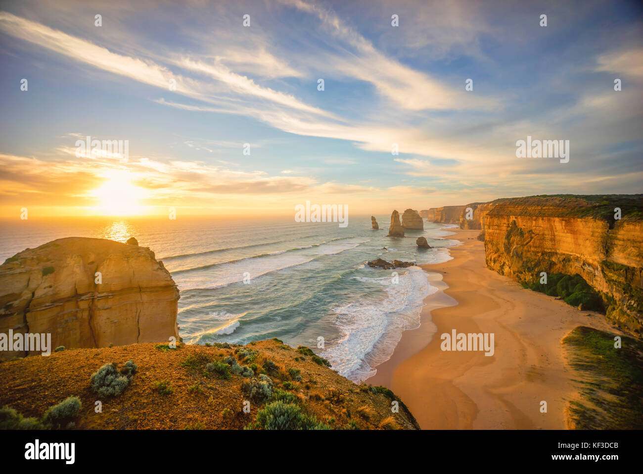 Dramatic sunset sky at unique rock formation along a coastline. The ...