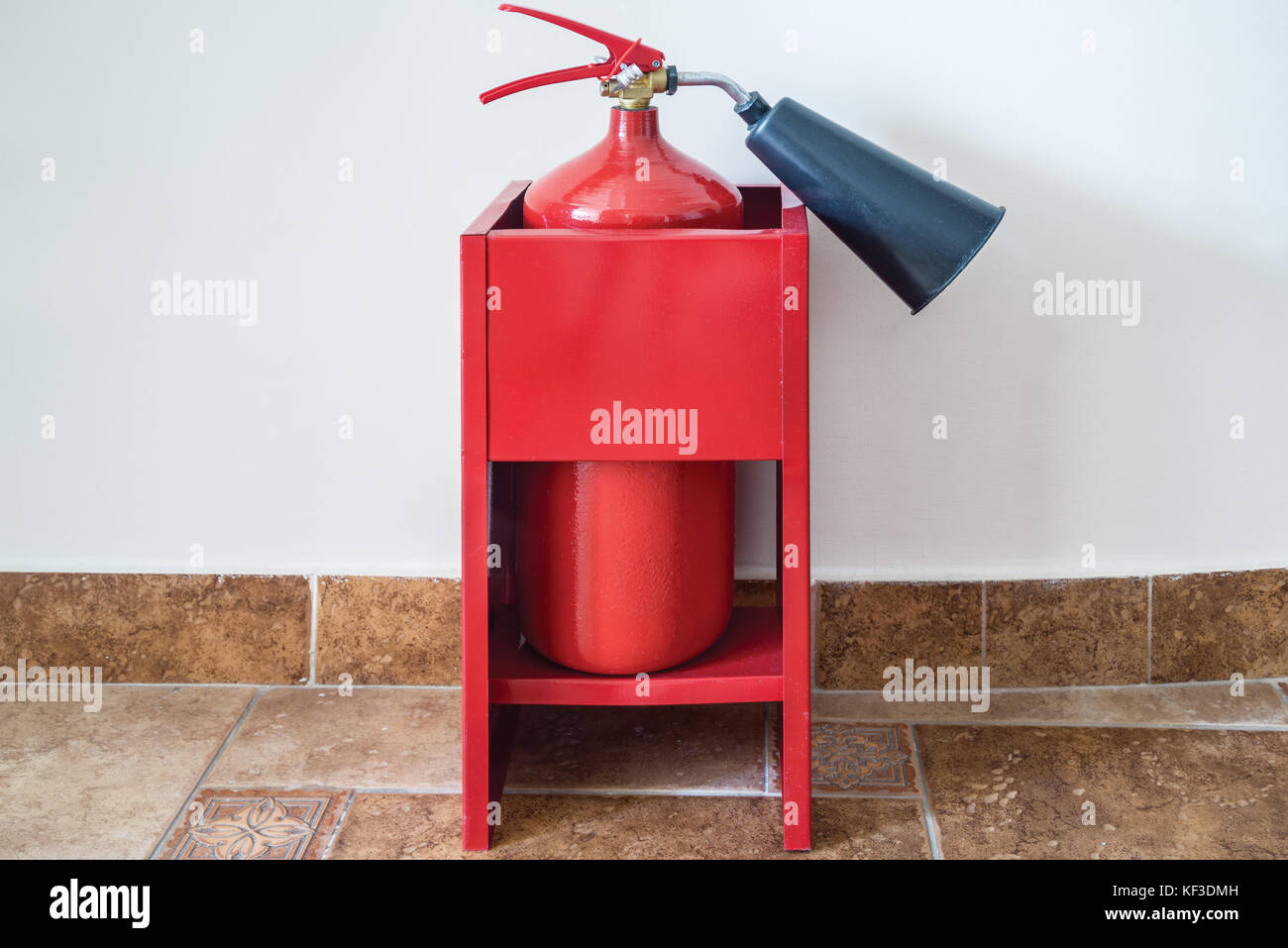 Fire extinguisher by the wall in the corridor Stock Photo - Alamy