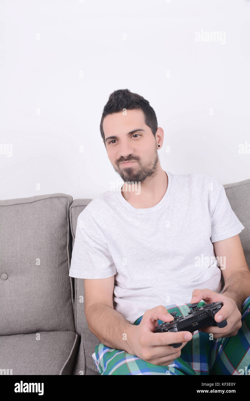 Guy playing video game on couch hi-res stock photography and images - Alamy