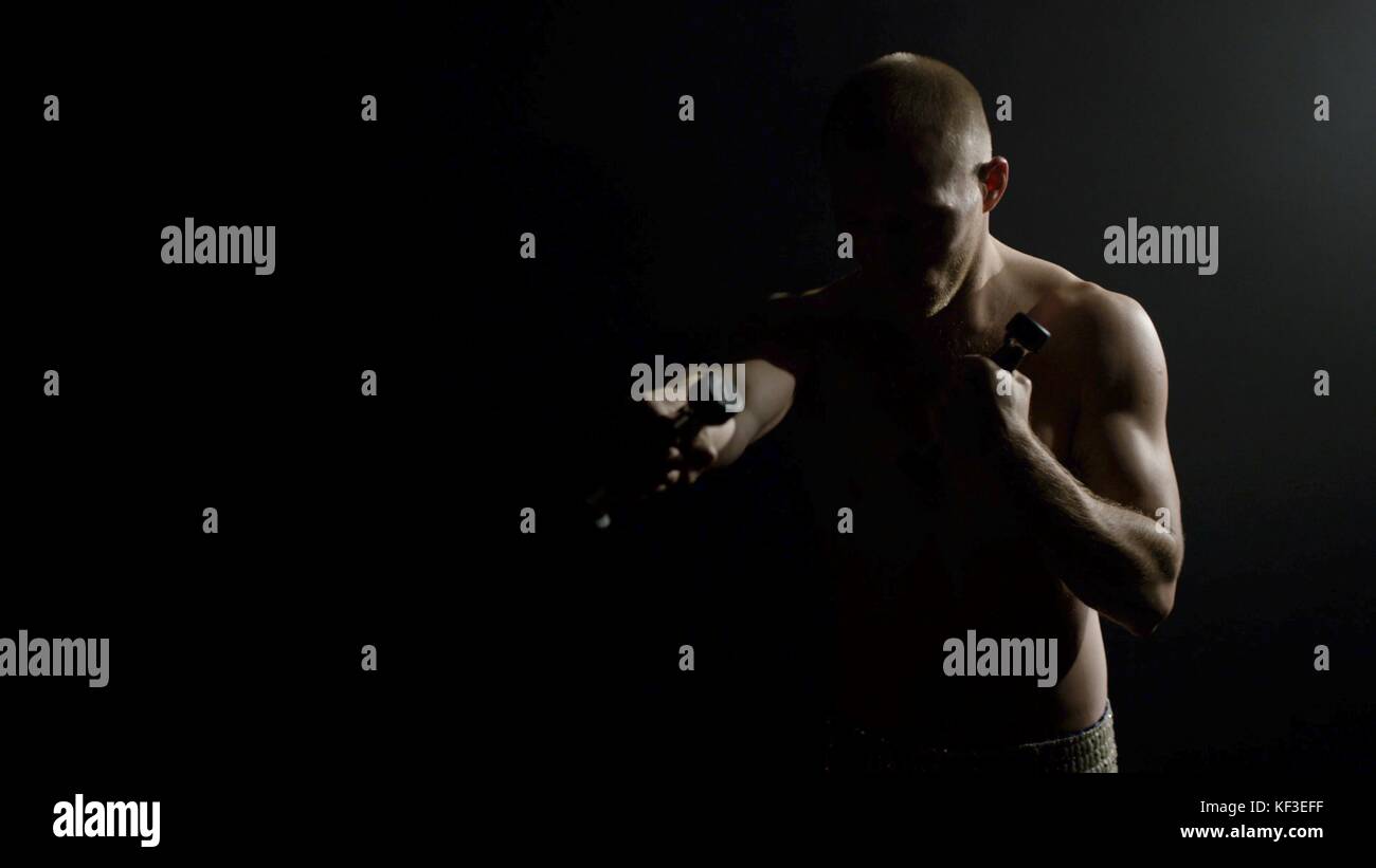 Fight with shadow on dark background. Fighter in studio. side view ...