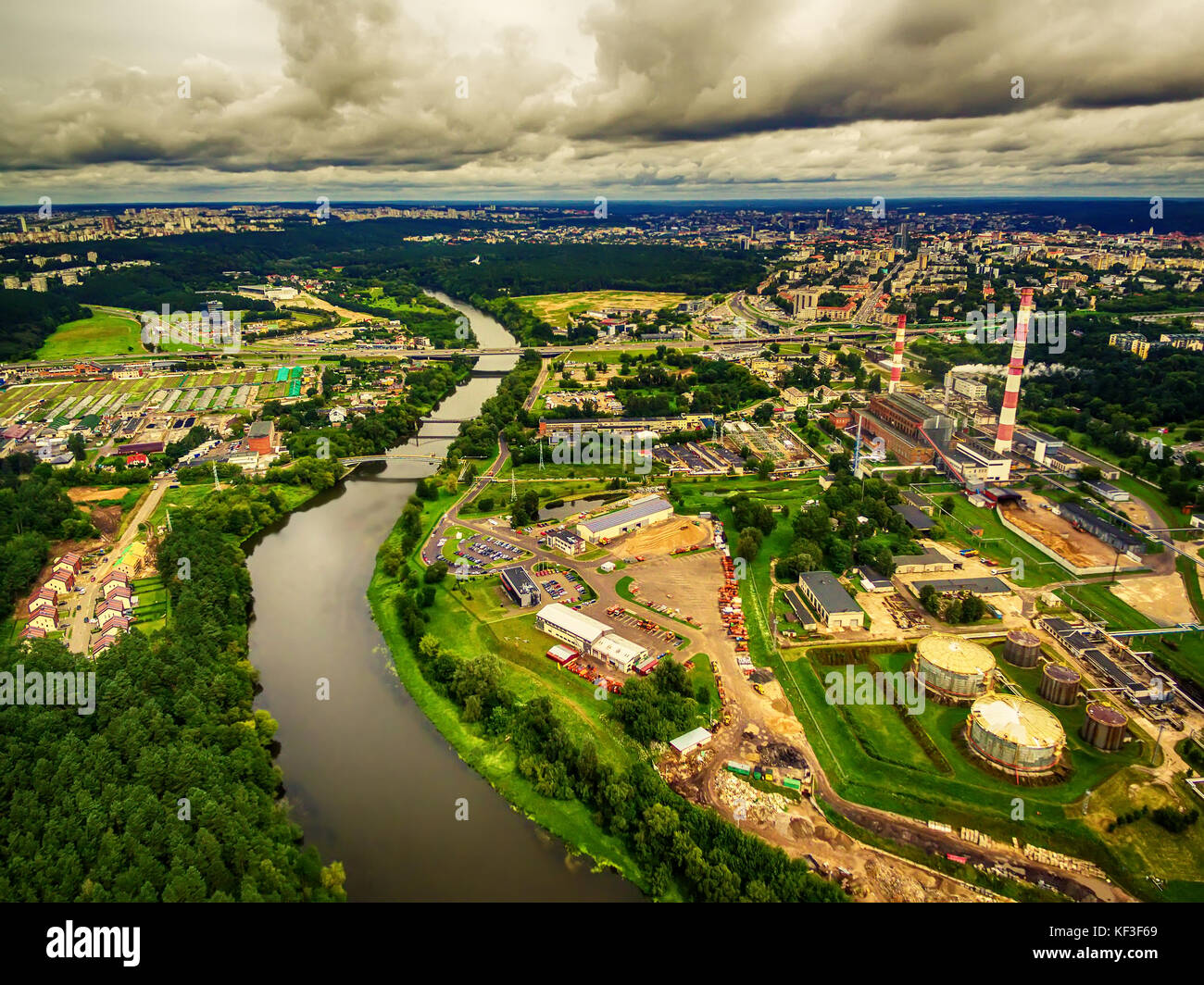 Vilnius, Lithuania: aerial UAV top view of Neris river and industrial ...