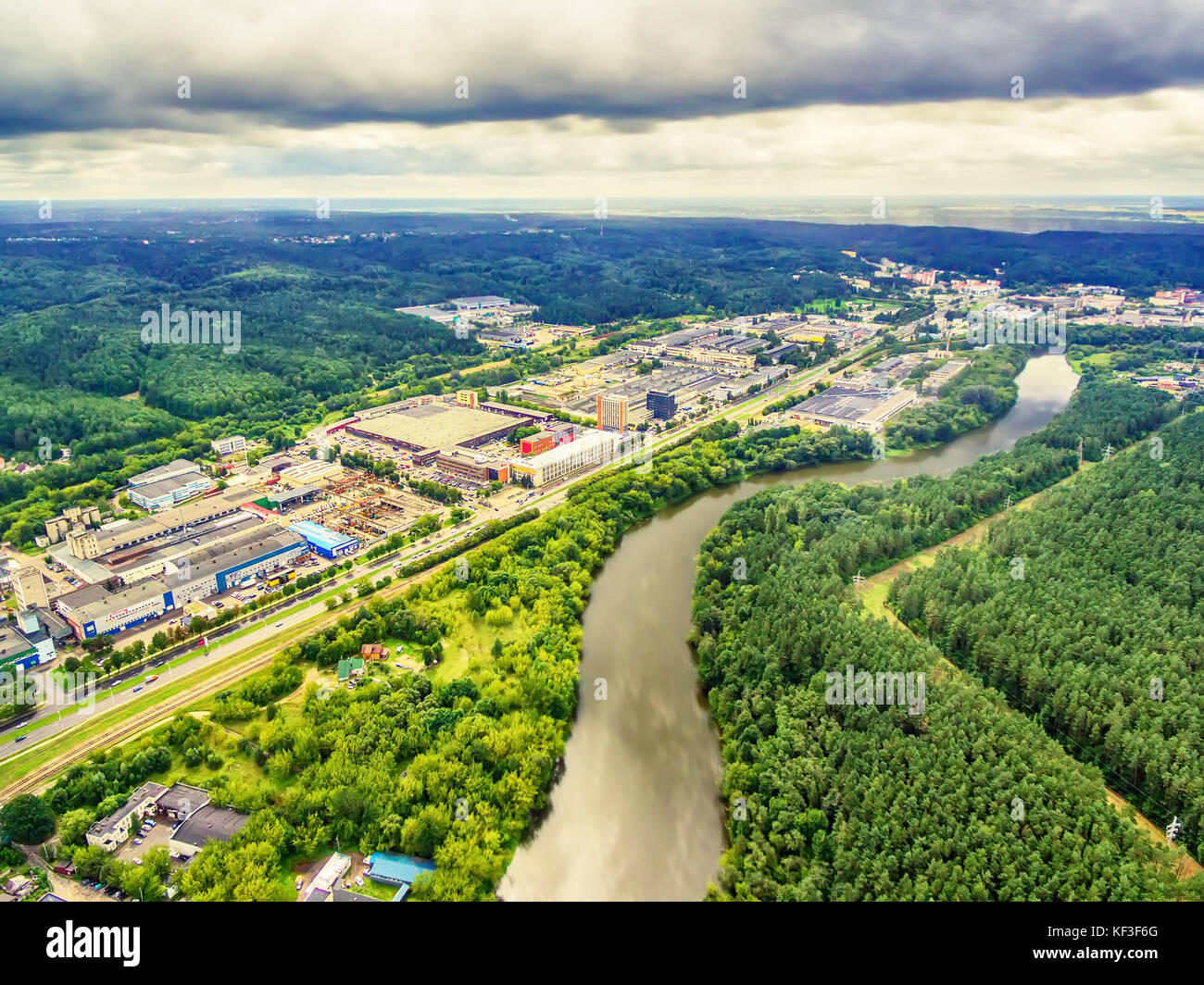 Vilnius, Lithuania: aerial UAV top view of Neris river and industrial ...