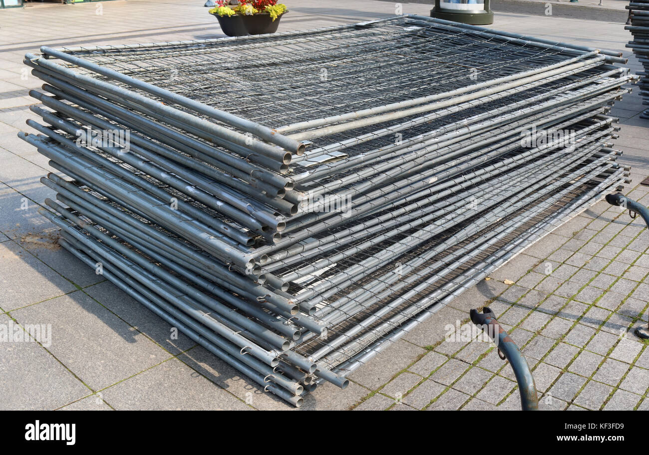 A stack of modular steel fence elements made of galvanized steel ...