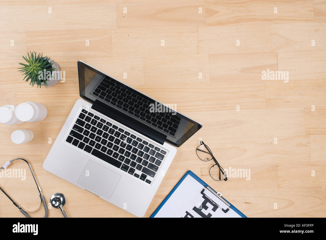 Top view of doctor desk table with stethoscope and notebook with a ...