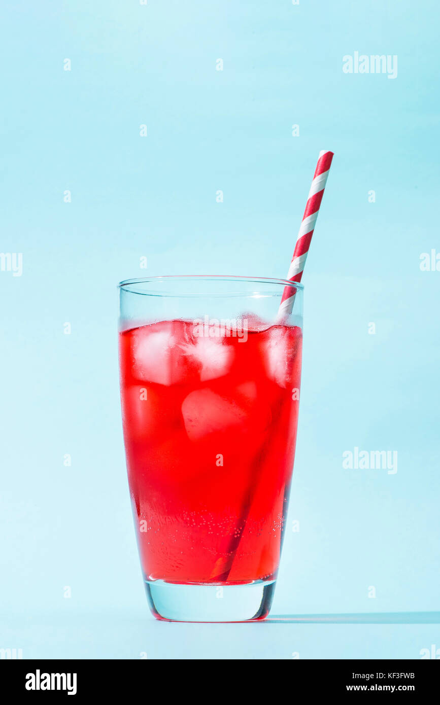 Sparkling red color drinks with water soda and ice in glass Stock Photo ...