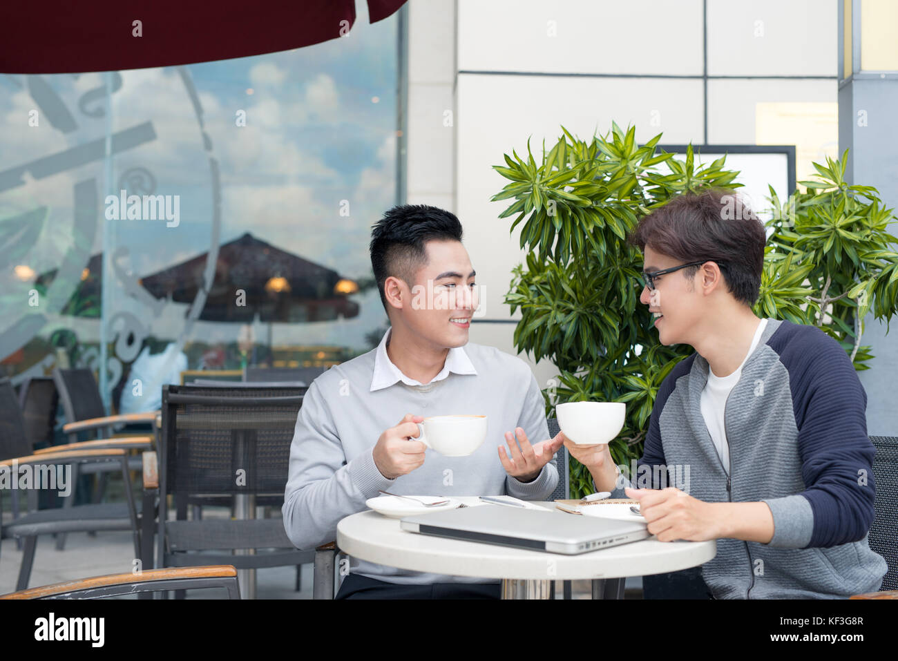 Business partners working in team, discussing issuesand sharing new ...