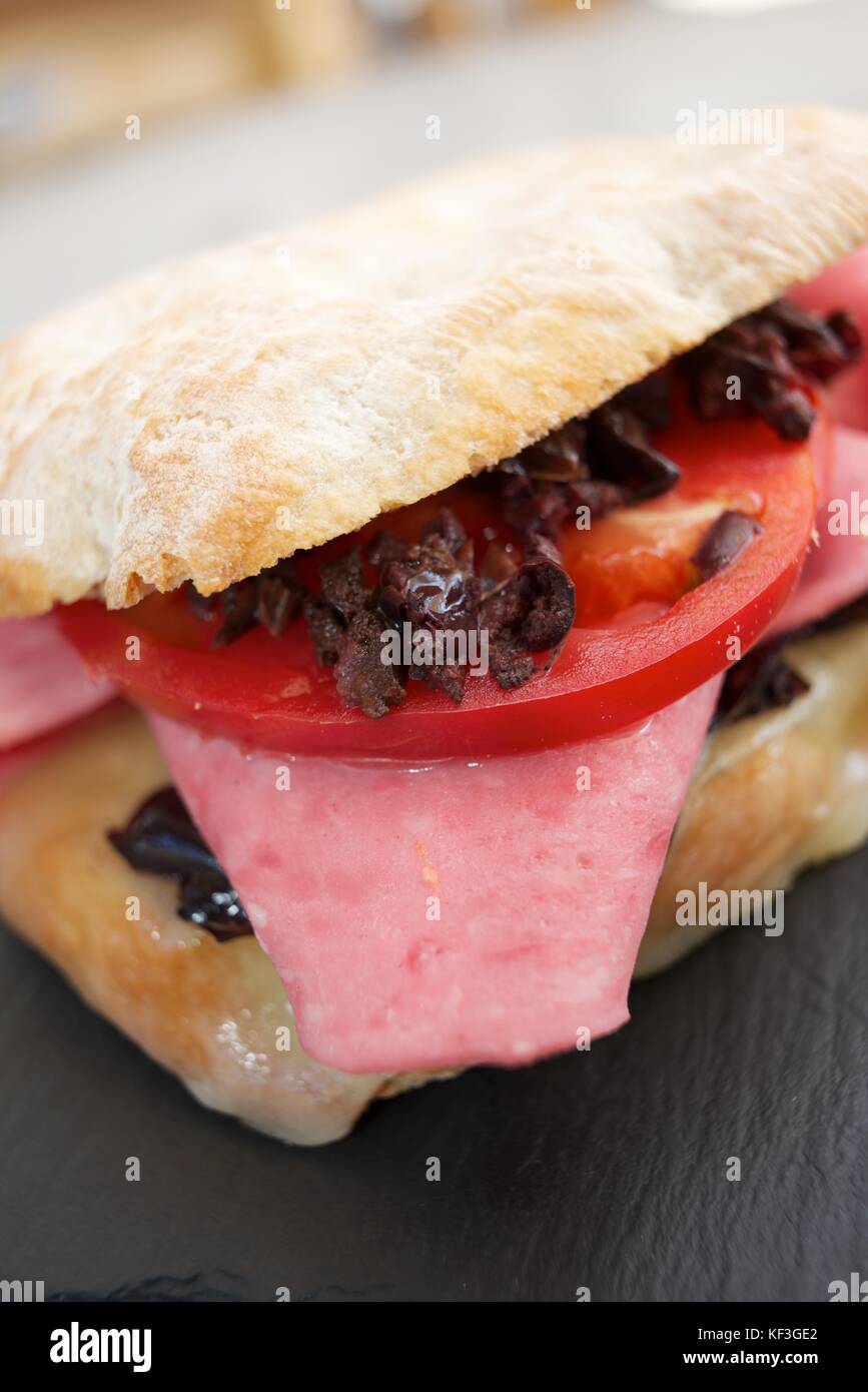 Mortadella sandwich, tomato and black olives Stock Photo - Alamy