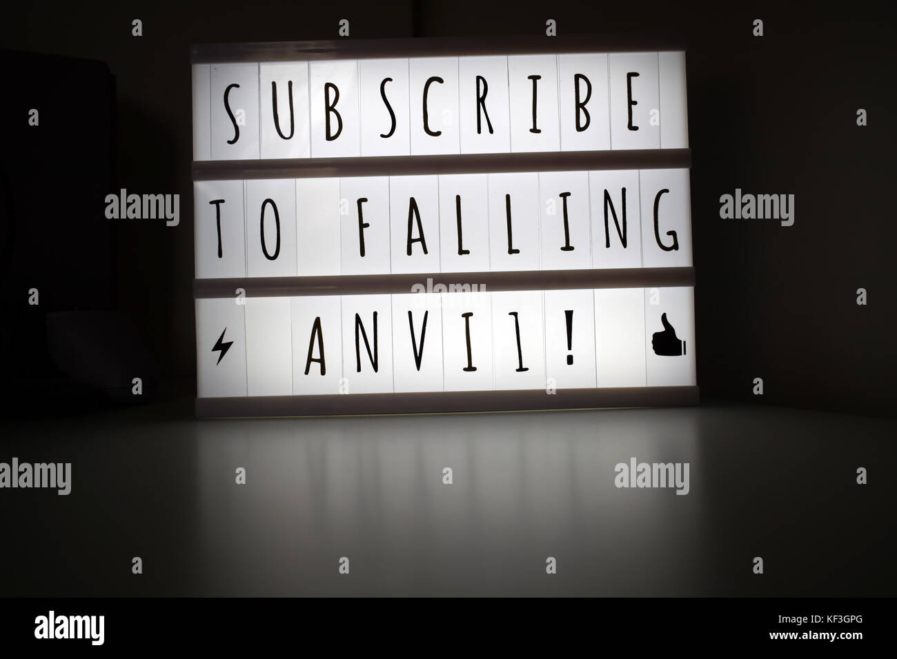 Illuminated sign 'subscribe to falling anvil' Stock Photo - Alamy