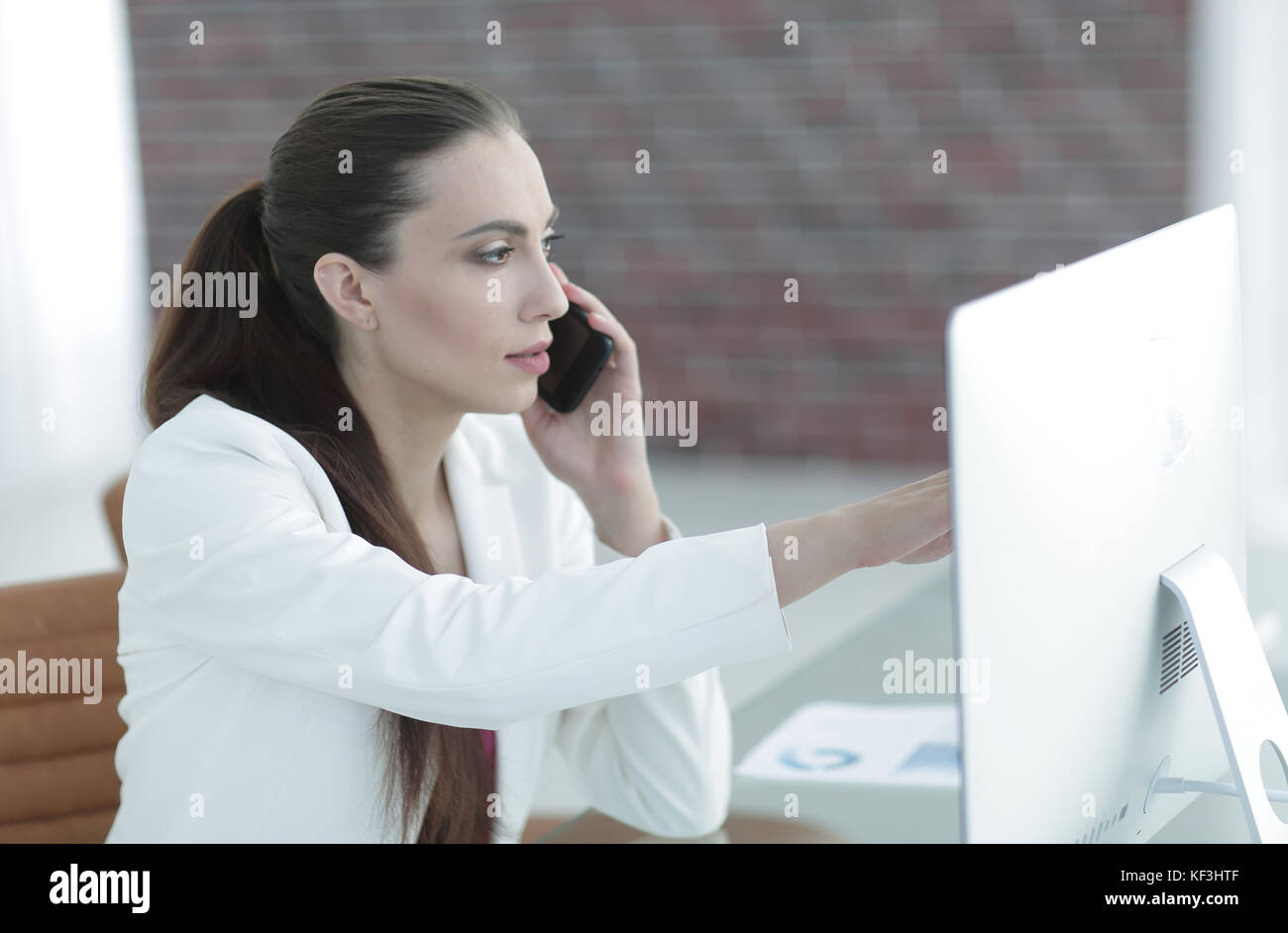 employee discusses operational issues on a mobile phone Stock Photo - Alamy