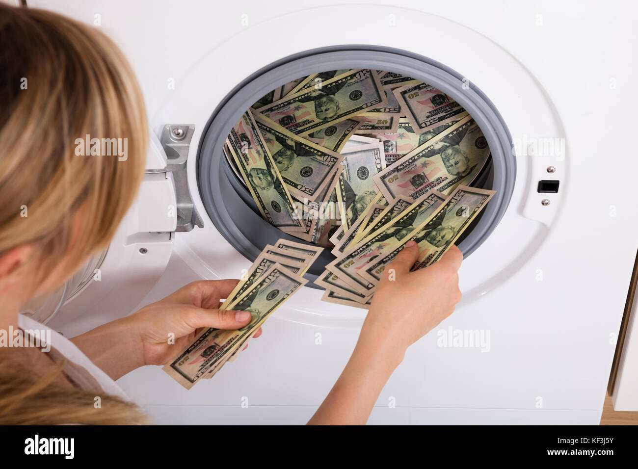 Close-up Of Person Hand Inserting Dirty Money In Washing Machine Stock ...