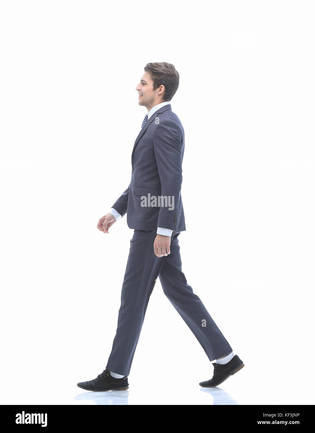 .confident businessman goes forward.side view Stock Photo - Alamy