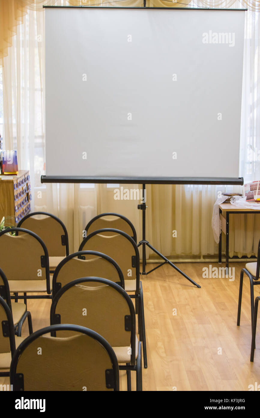 Screen for filmstrip in the hall of the library Stock Photo - Alamy