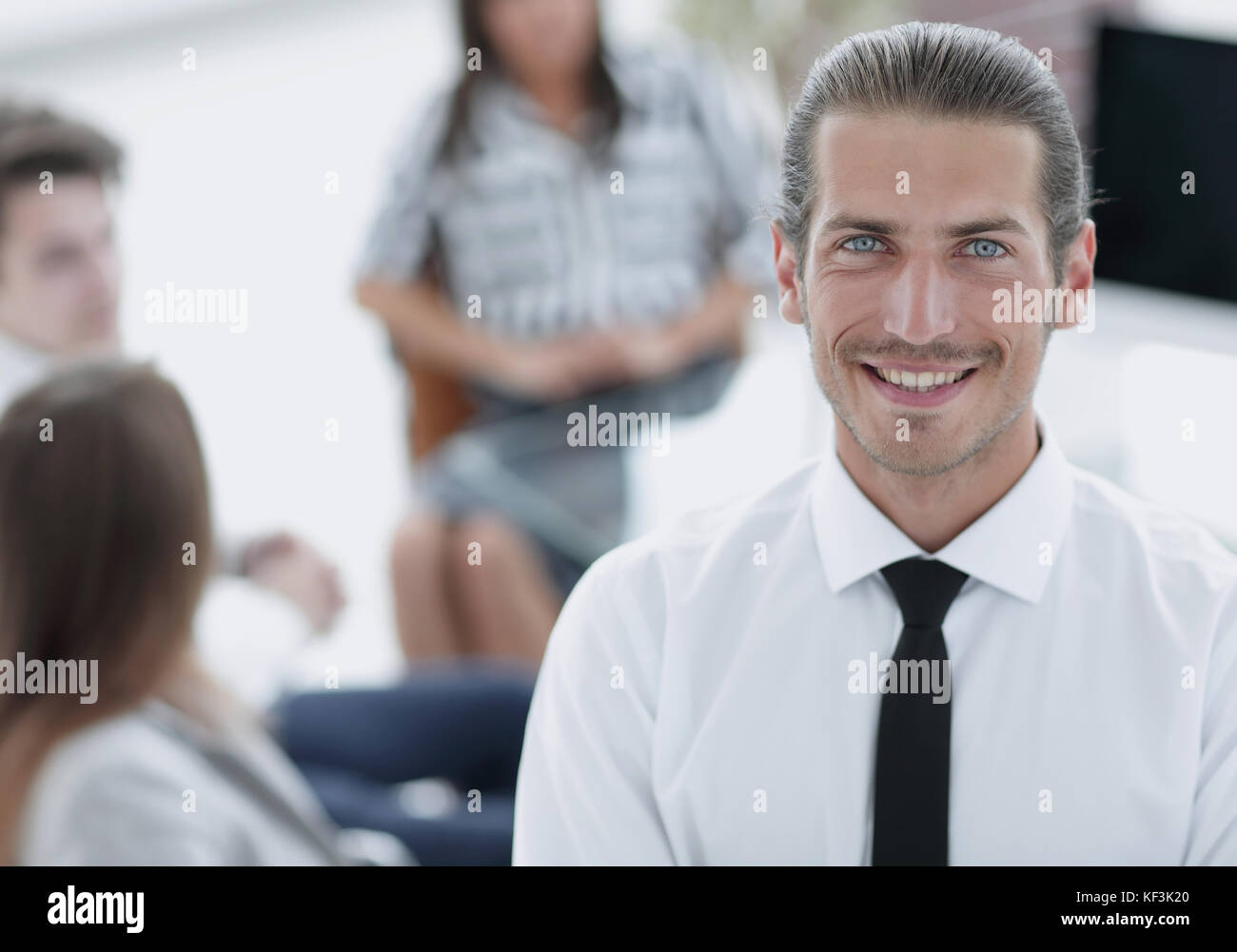 successful young business men on blurred background.photo with copy ...