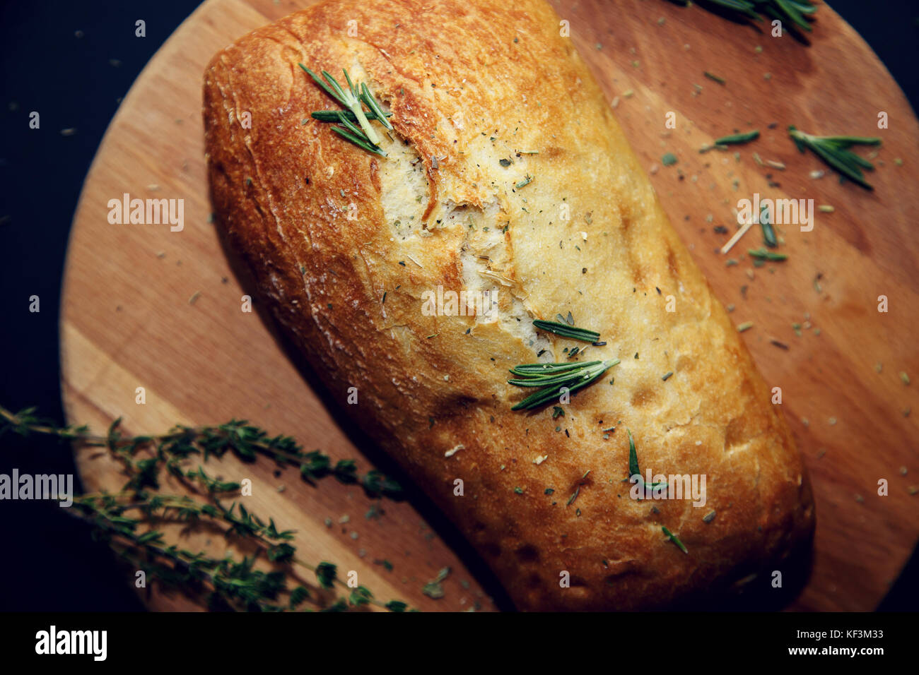 Traditional Italian ciabatta bread with herbs. Black background Stock ...