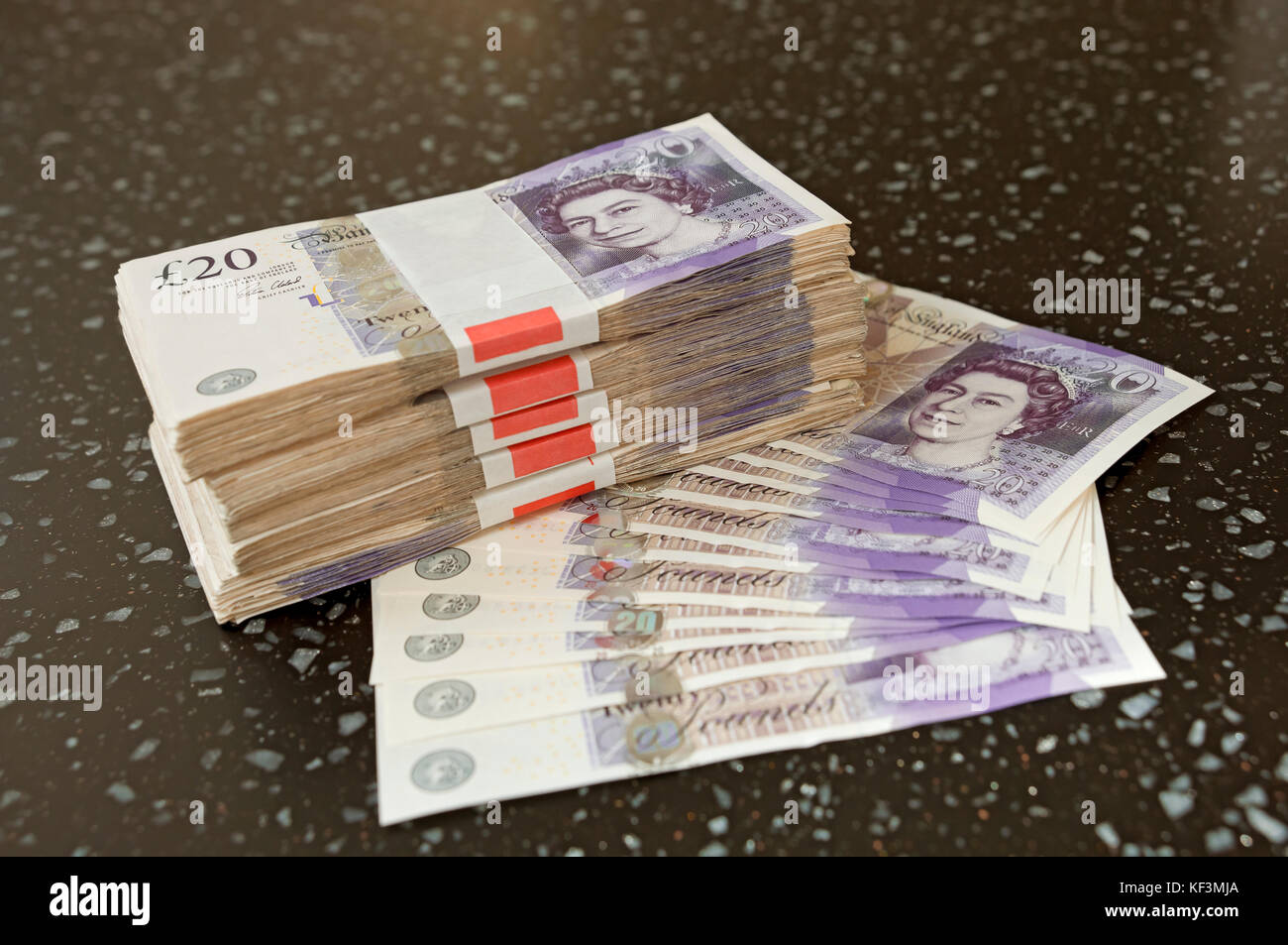 Close up of bundles of English money cash £20 twenty pound notes ...