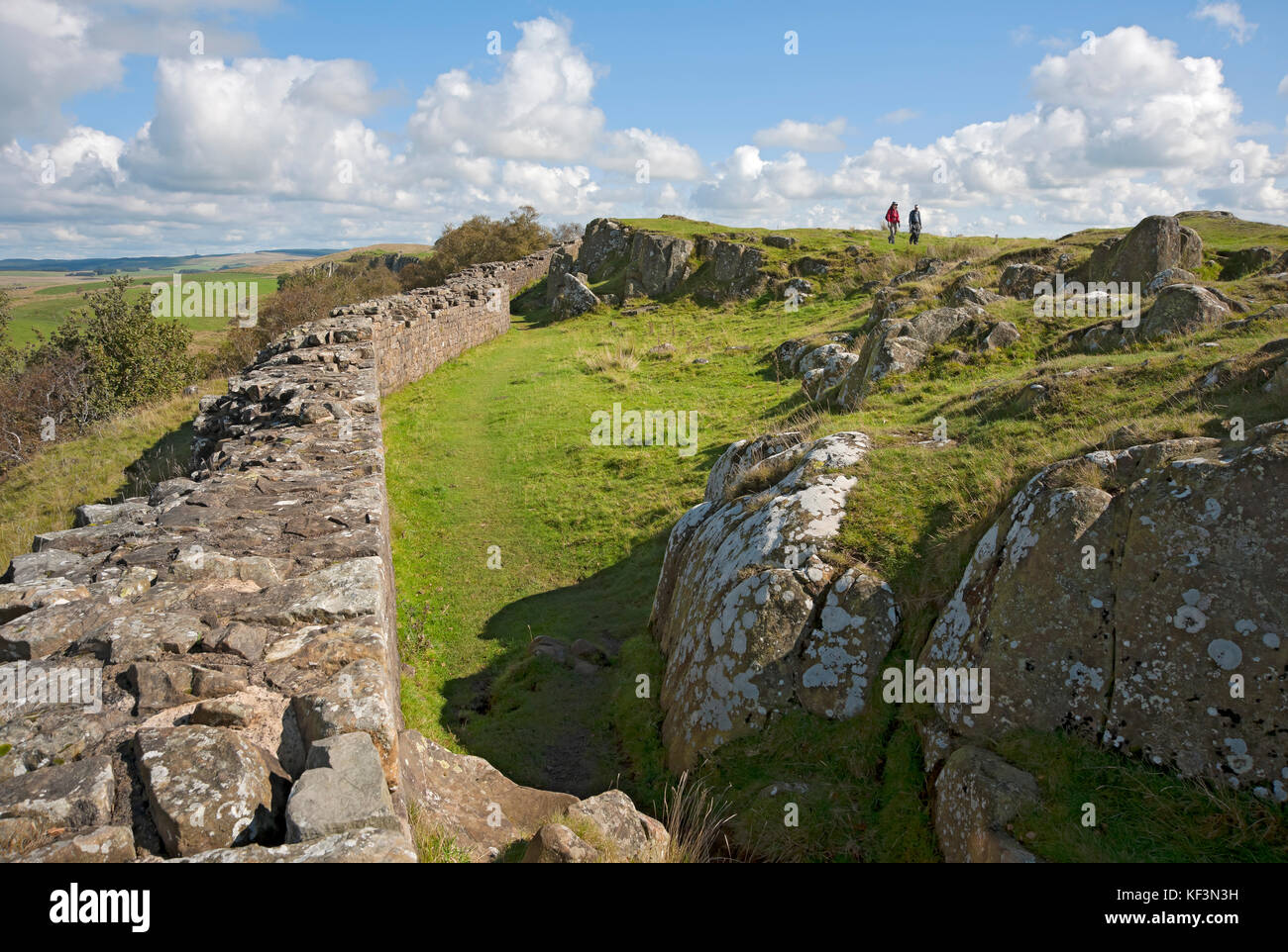 People walker walkers walking along section of Roman Hadrian's Wall ...