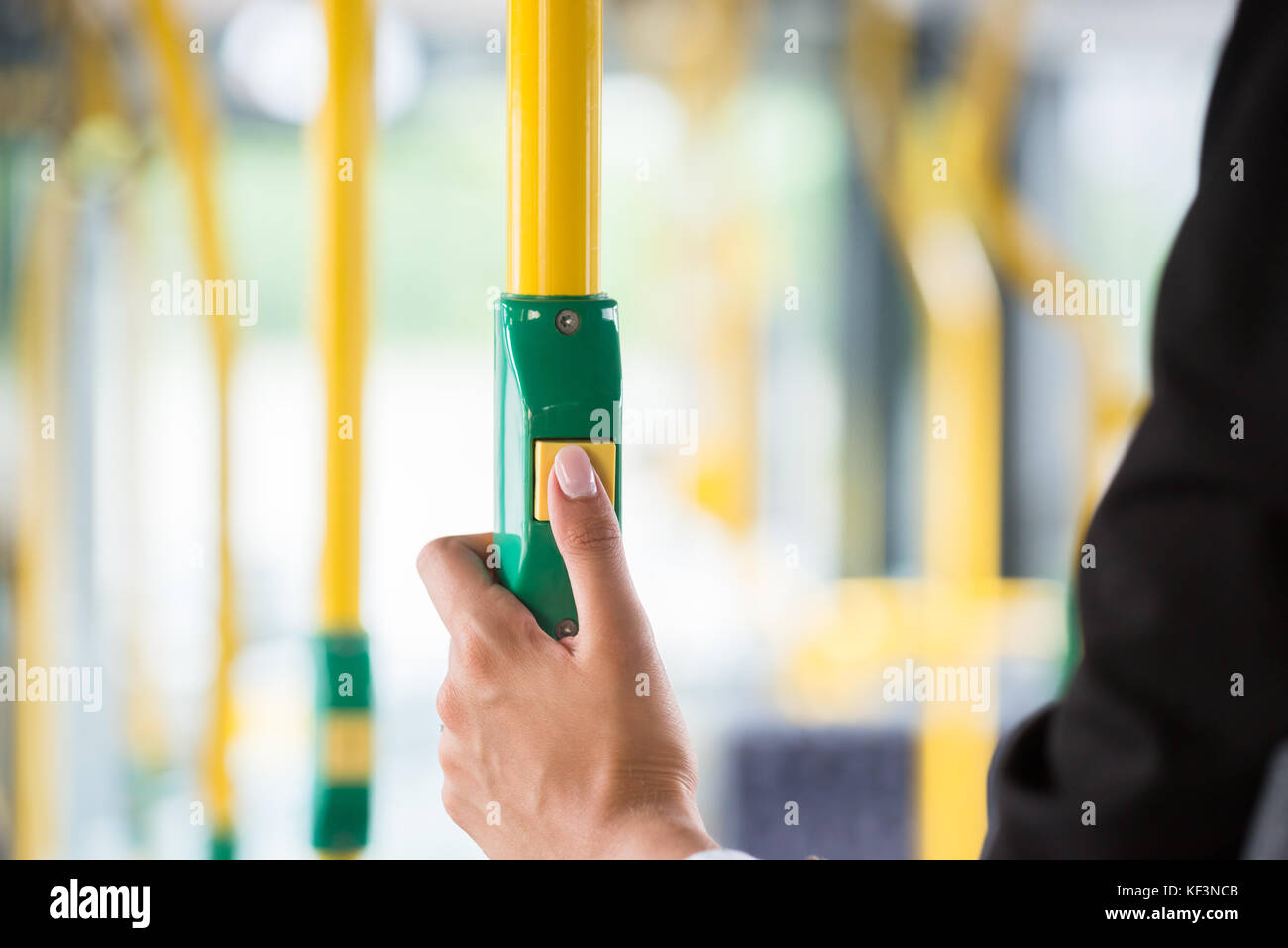 Close-up Of A Businesswoman's Hand Pressing Stop Button On Bus Stock ...