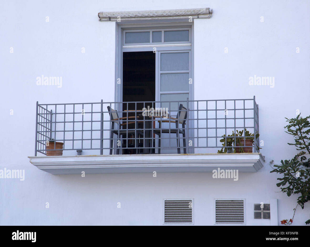 Open door onto a balcony, modern simple design, pale and mid-grey ...