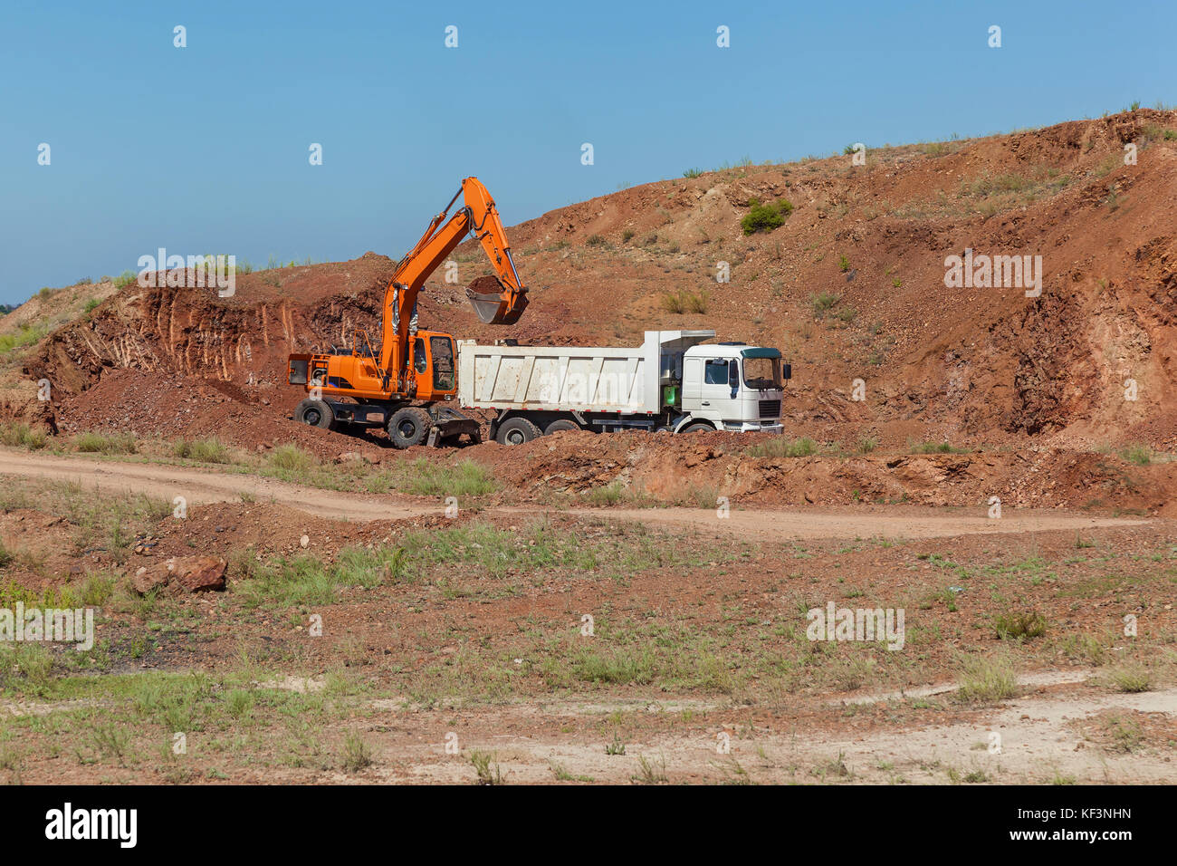 Backhoe loading dumper truck hi-res stock photography and images - Alamy