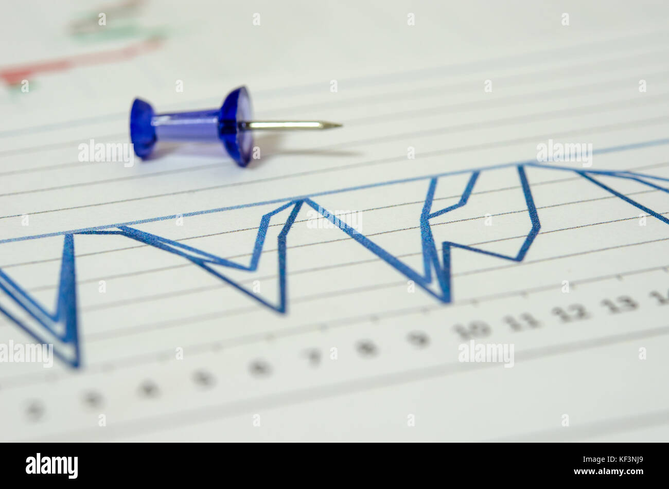 Business paper Line graph on desk Stock Photo - Alamy