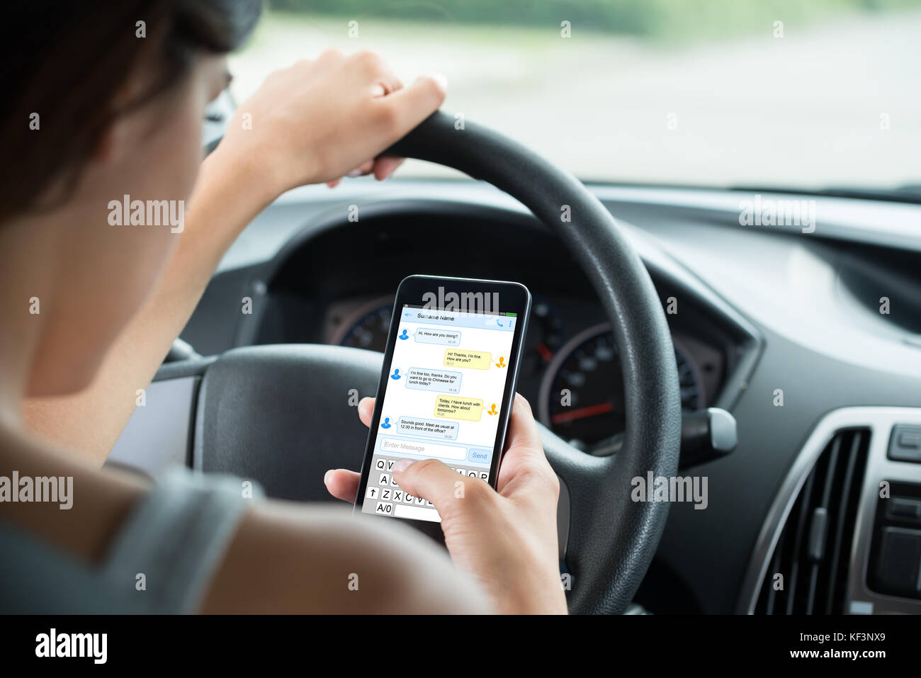 Close-up Of Woman Sitting Inside Car Typing Text Message On Mobile ...