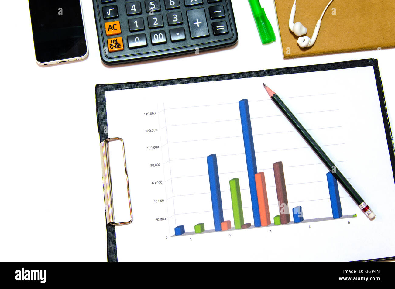 Office desk workplace with charts, smartphone and pencil on table. Top ...
