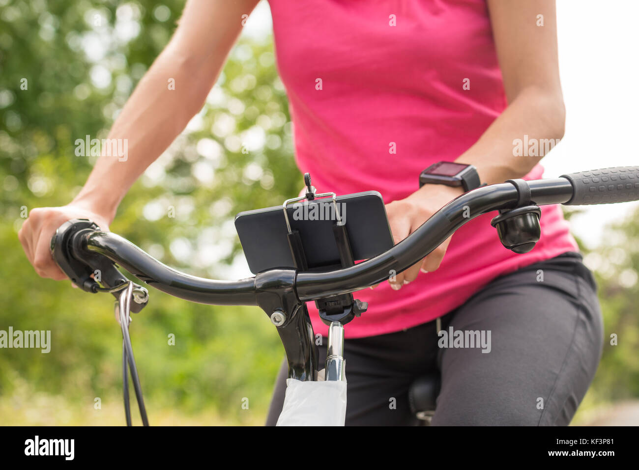 Using mobile phone riding a bike hi-res stock photography and images ...
