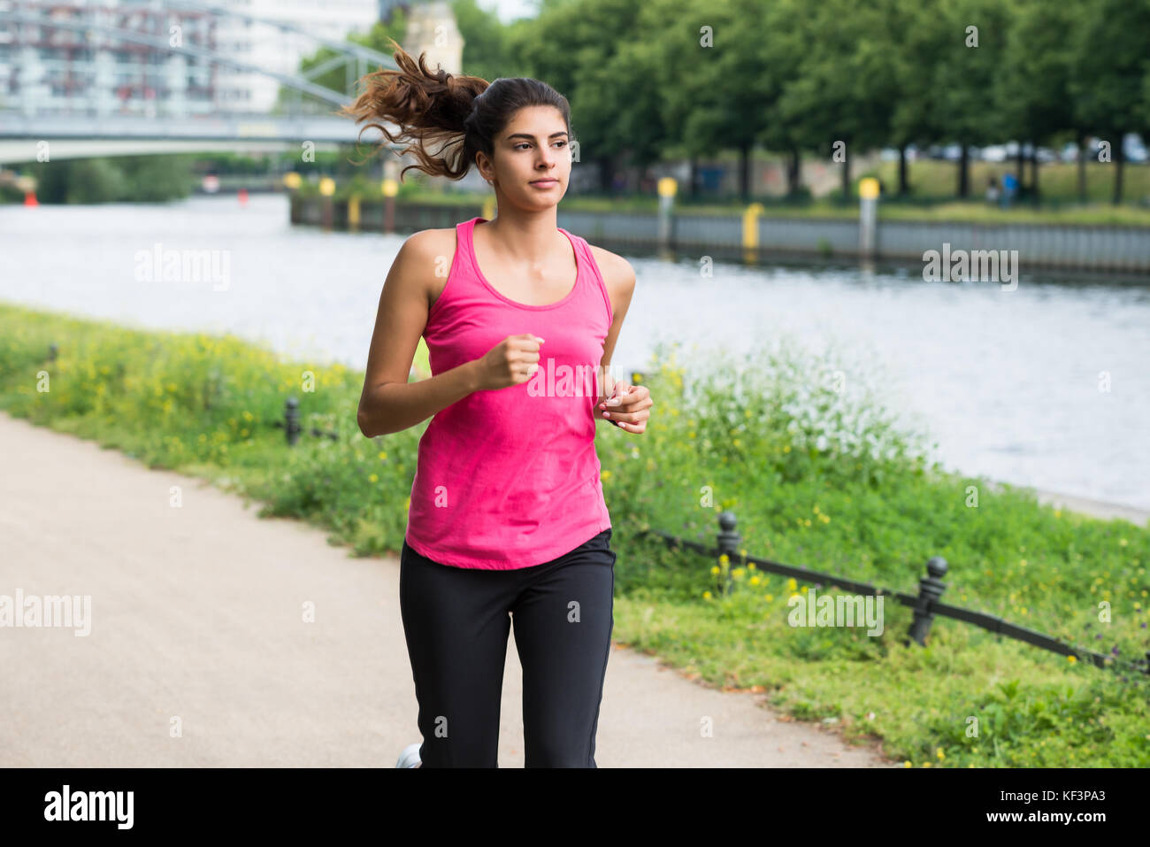Healthy Young Athletic Woman Running In Morning Stock Photo - Alamy