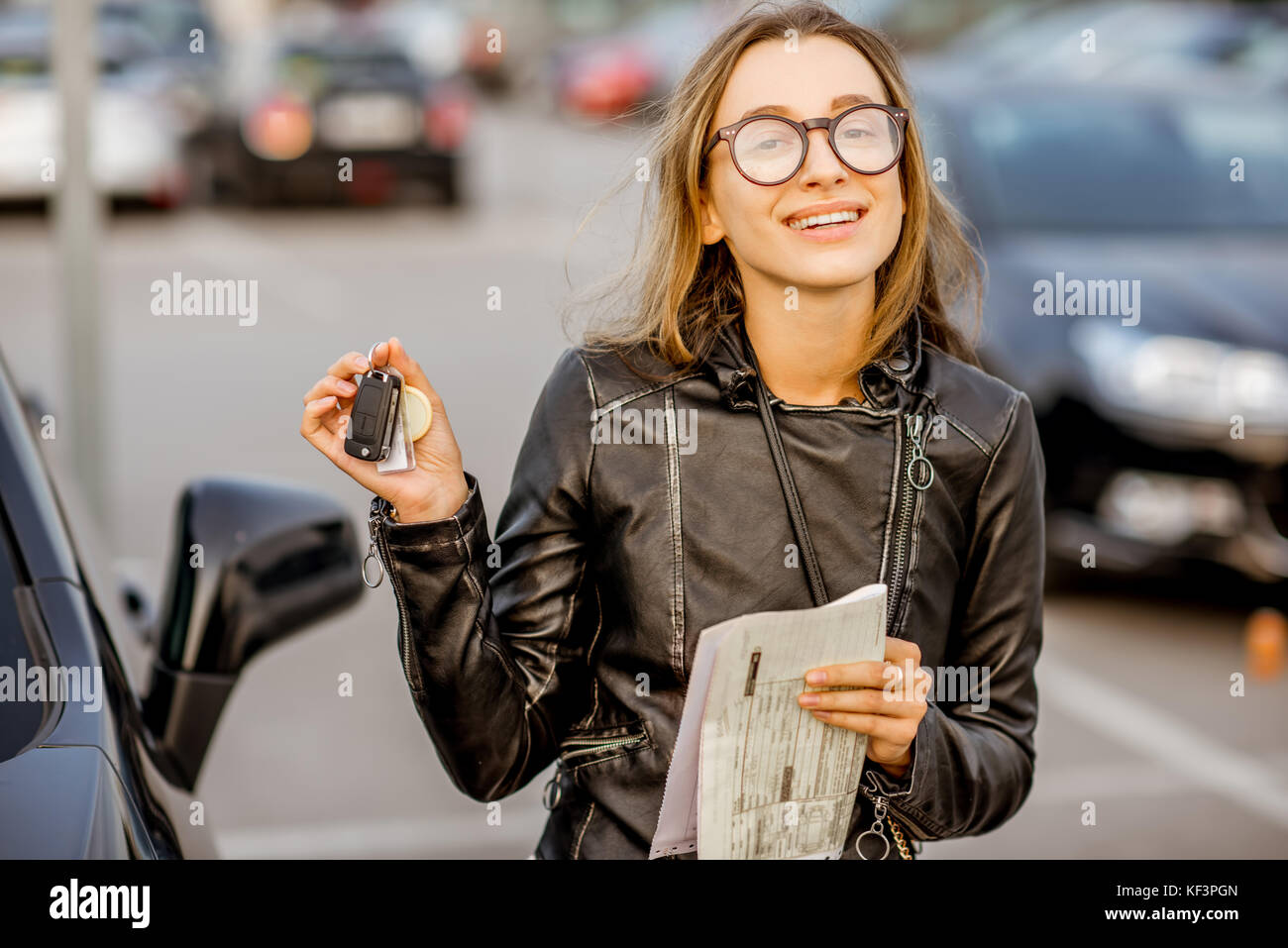 Woman renting a car Stock Photo - Alamy