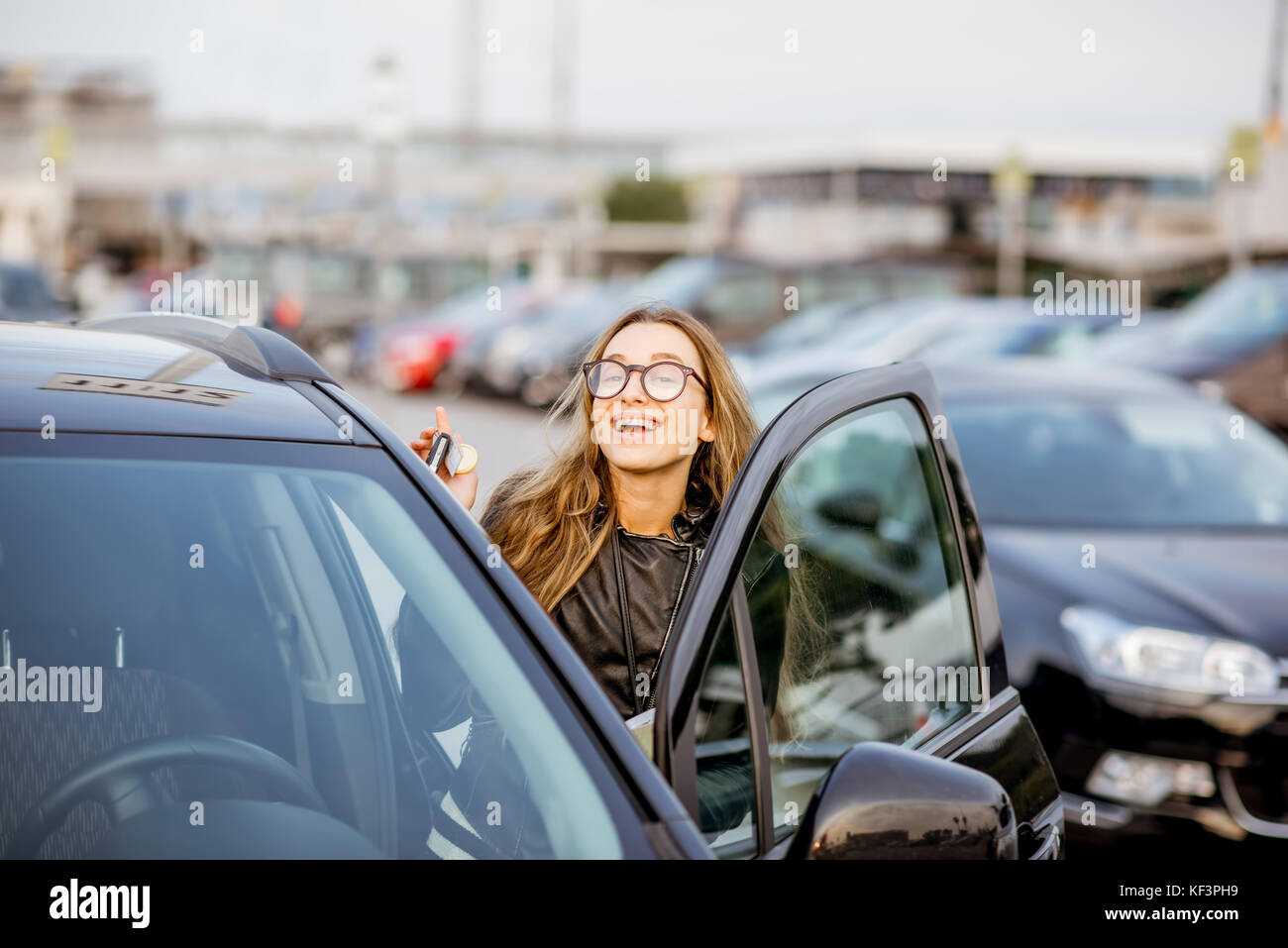 Woman renting a car Stock Photo - Alamy