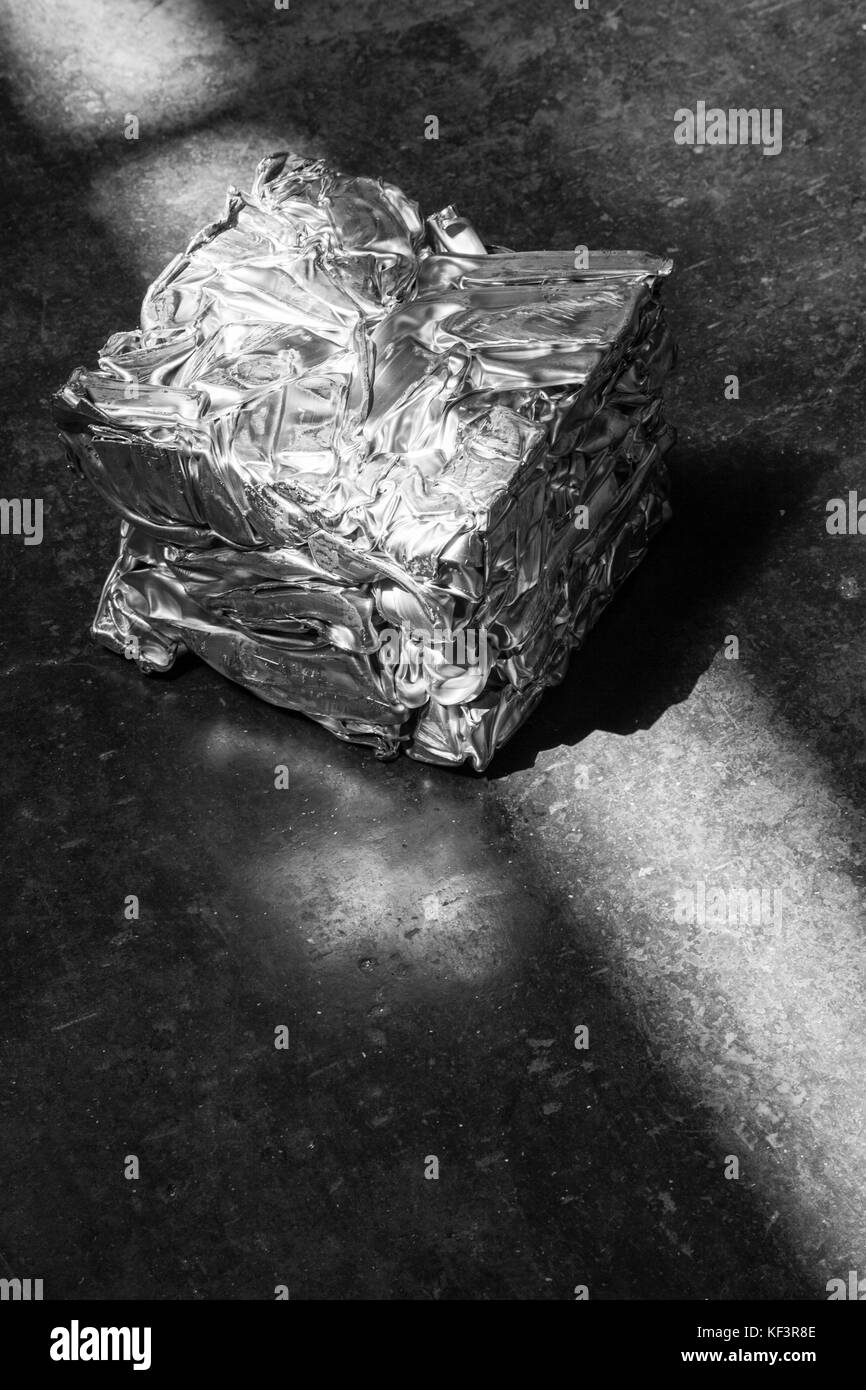 compacted into a cube of aluminum metal and illuminated strip lights ...