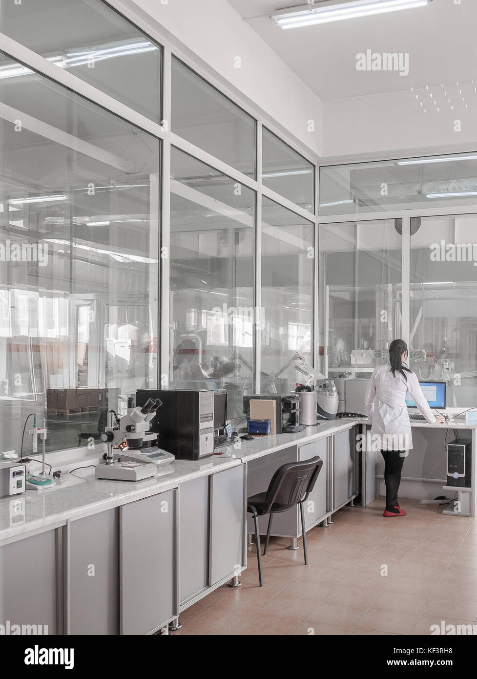 girl in an industrial laboratory tests on the quality of products Stock ...