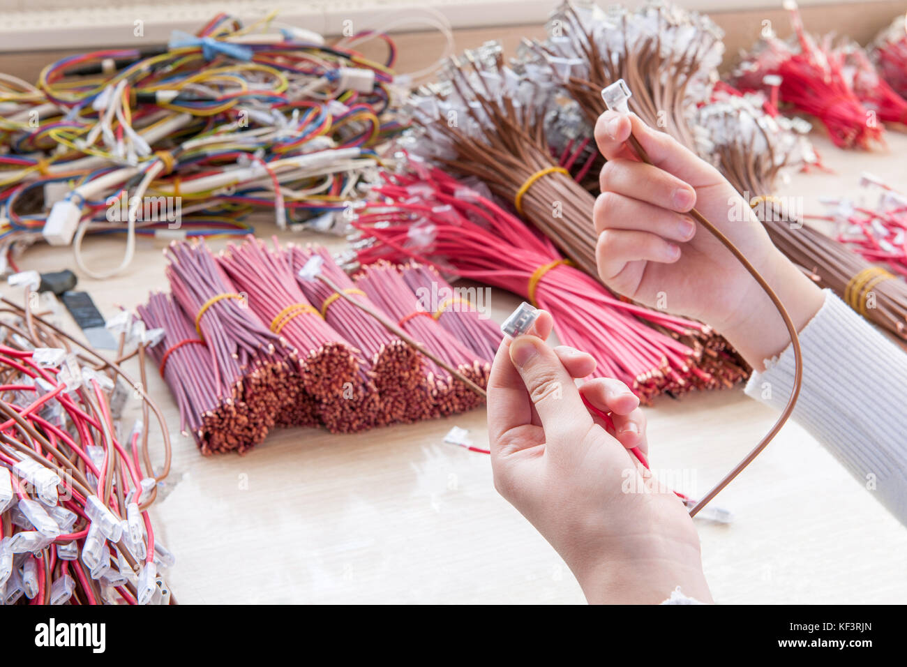 closeup manual assembly terminal blocks with wires in the production in ...