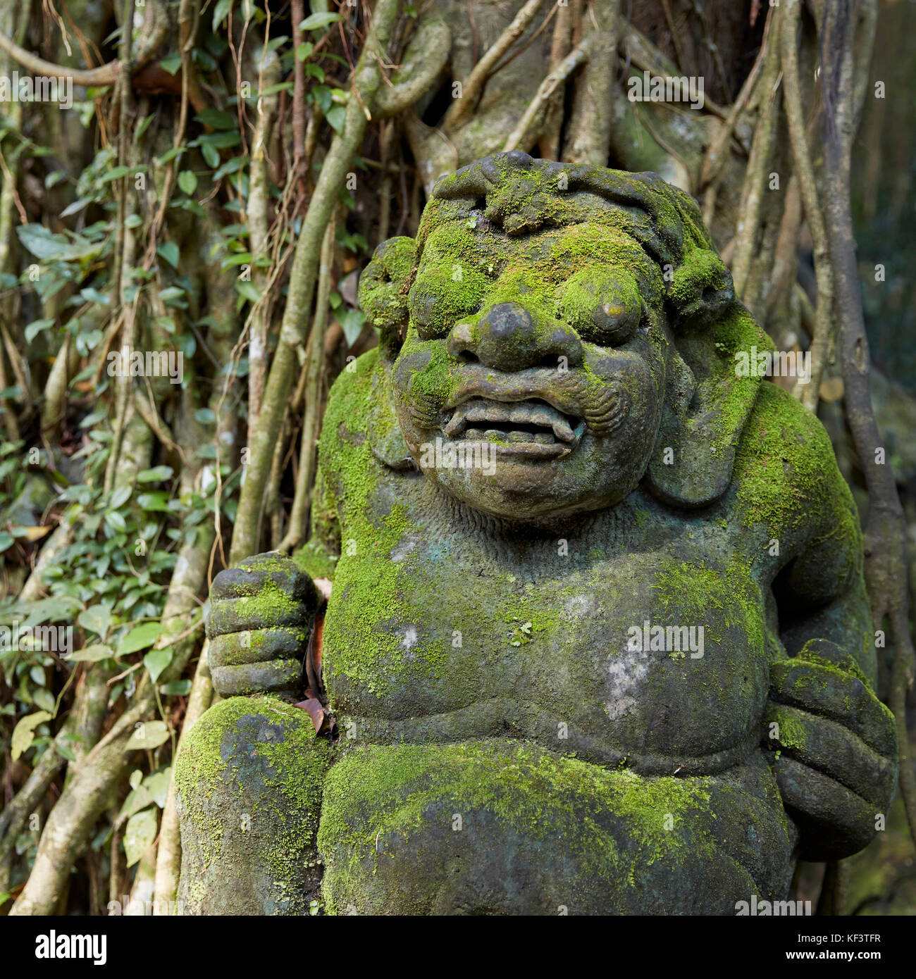 Mossy stone statue in the Sacred Monkey Forest Sanctuary. Ubud, Bali ...