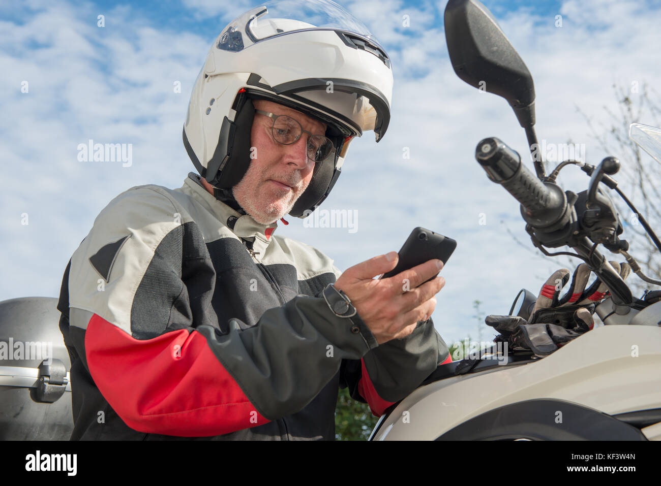 a portrait of a senior biker on his motorcycle Stock Photo - Alamy