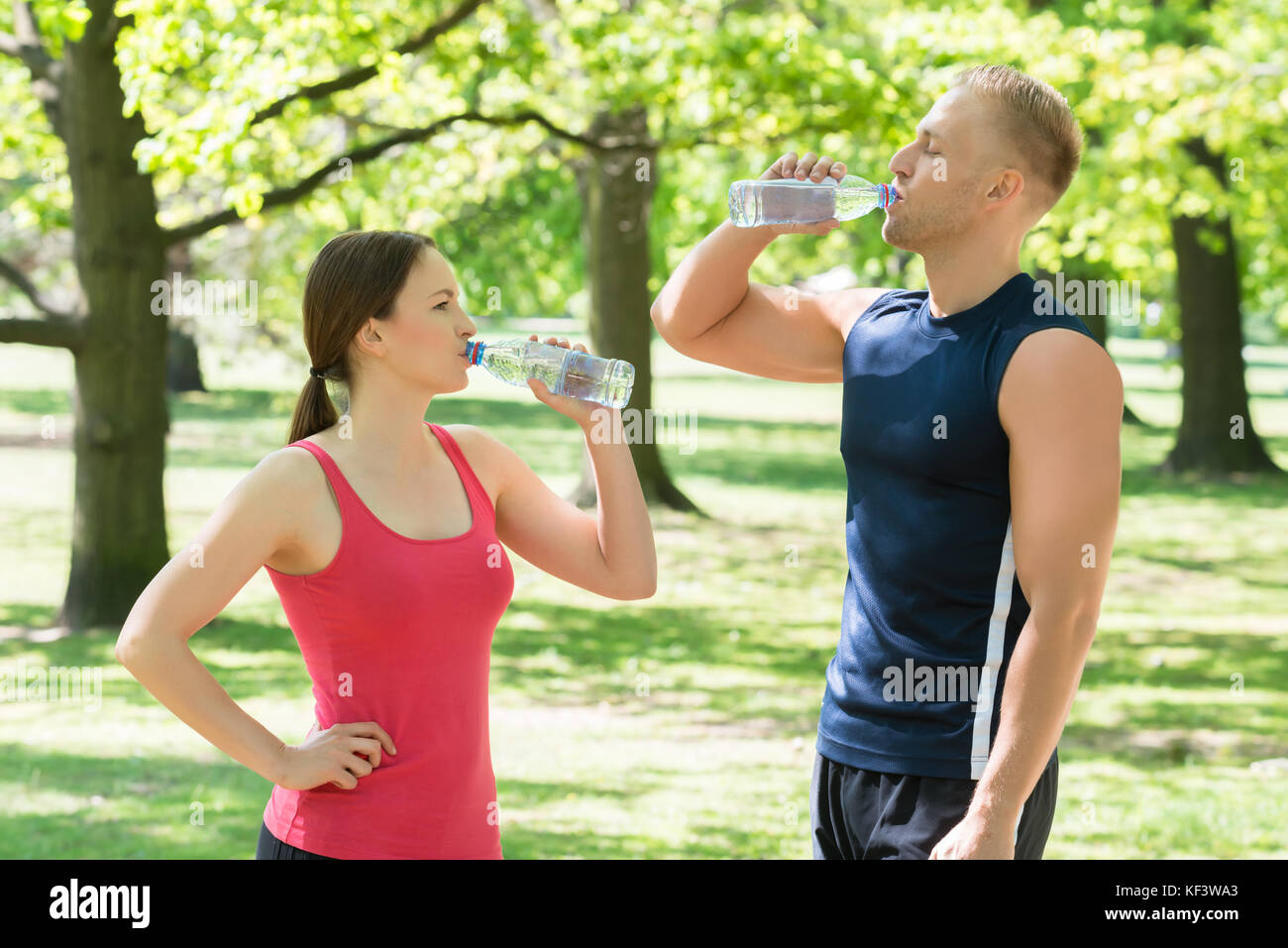 Healthy couple drinking water hi-res stock photography and images - Alamy