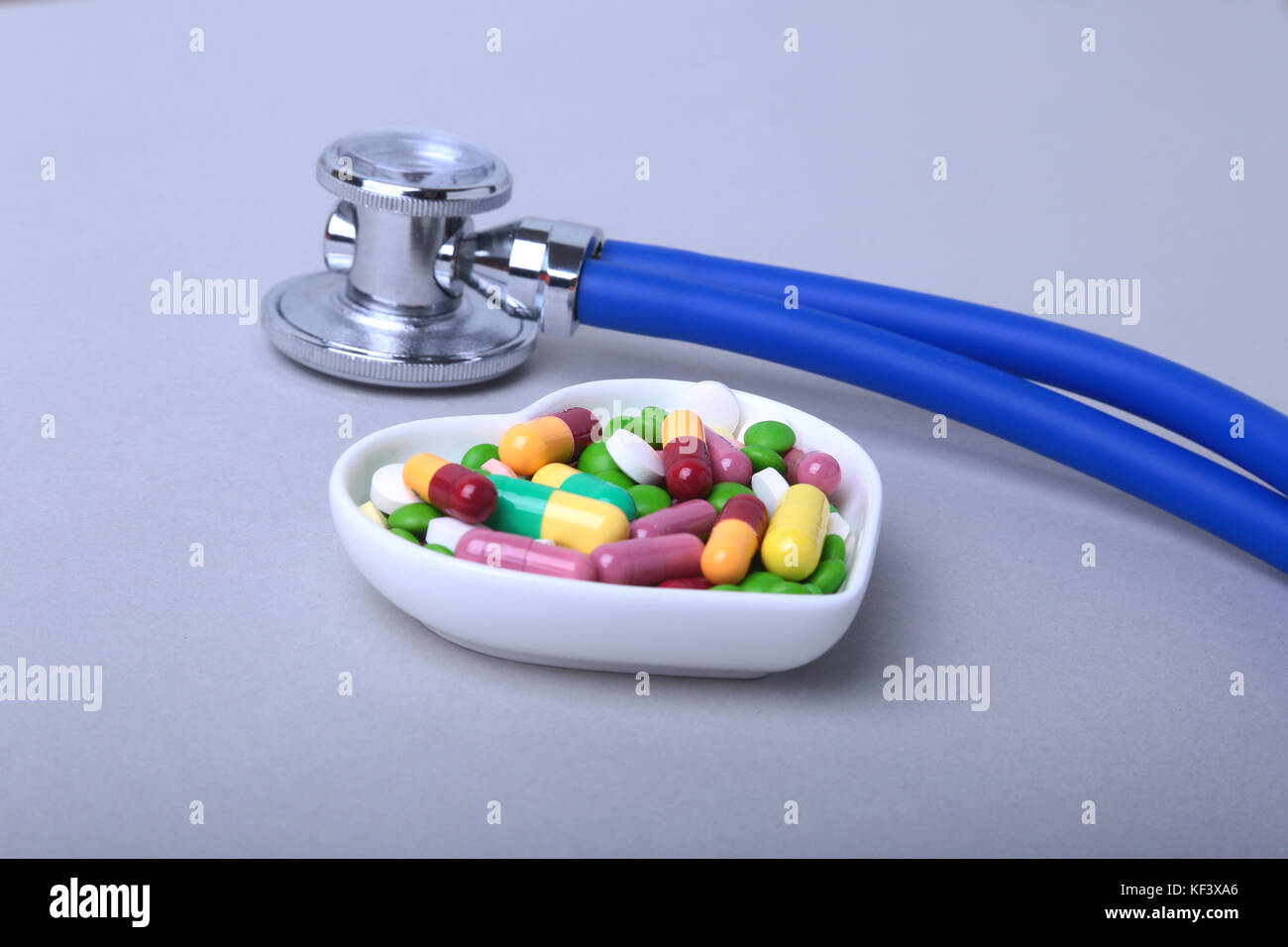 Stethoscope, RX prescription and colorful assortment pills and capsules ...