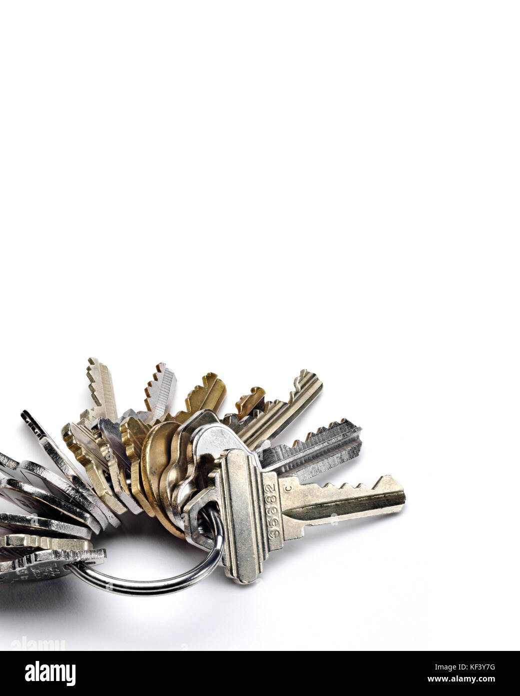 Close up of metal key ring with many worn keys isolated on white Stock ...