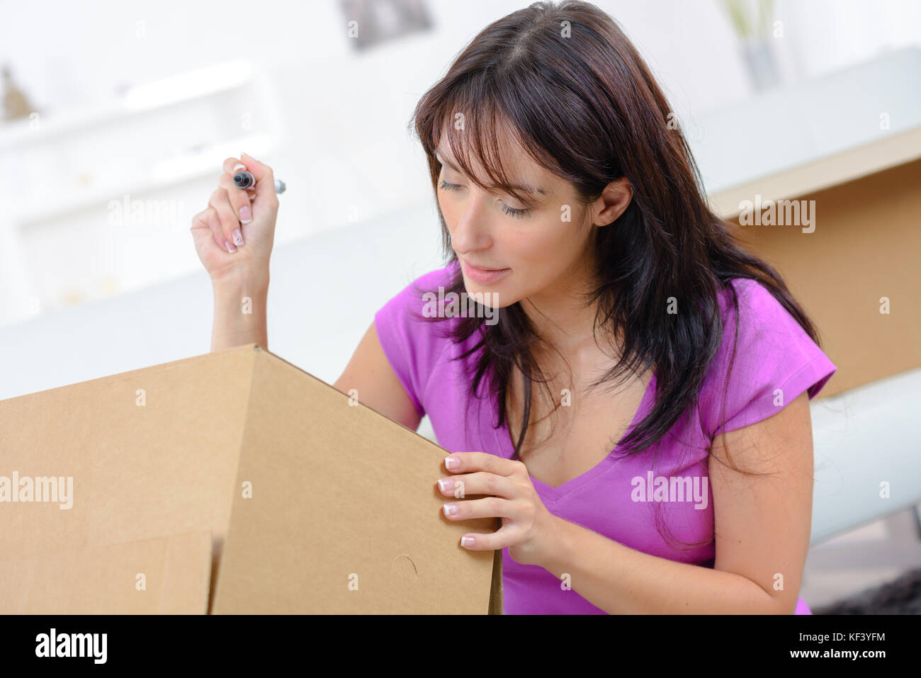 Woman writing on cardboard hi-res stock photography and images - Alamy