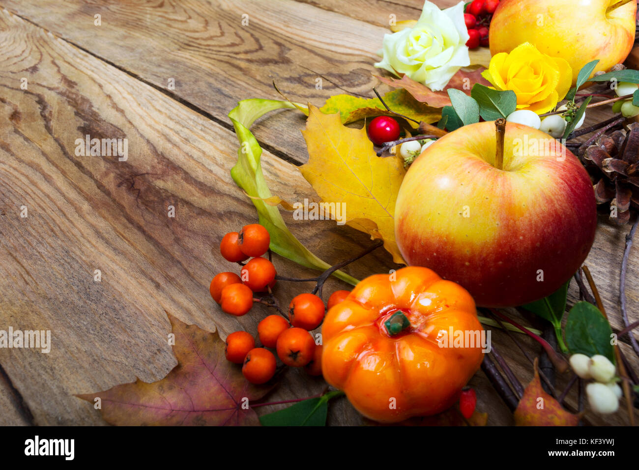 Thanksgiving background with pumpkin, apple, leaves, rowan and yellow ...