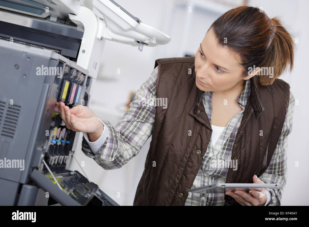maintenance department staff inspecting the office scanner Stock Photo ...
